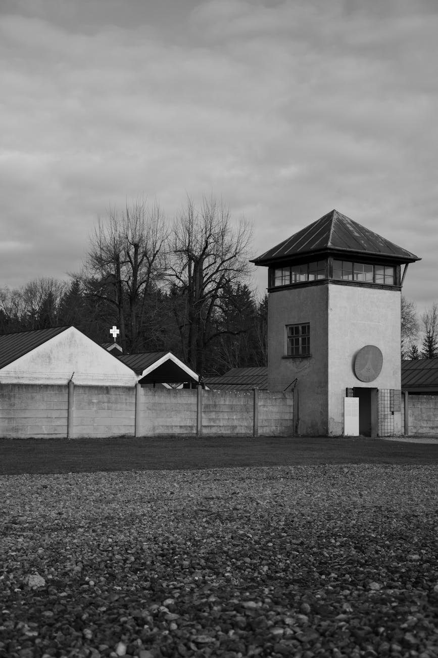 Watchtower at Dachau memorial reflecting history