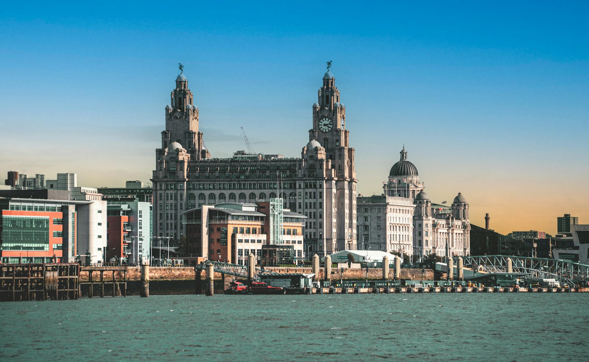 Historic Liver Building and Liverpool waterfront at sunset
